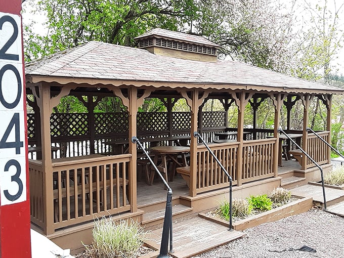 The gazebo isn't just outdoor seating &ndash; it's a community gathering spot where strangers become friends over shared fries.