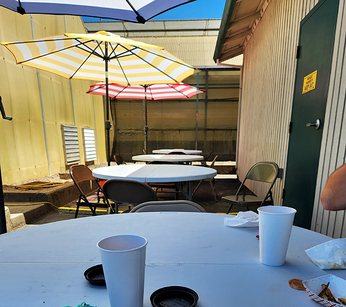 Colorful umbrellas create an oasis of casual dining charm. These simple tables have witnessed countless food epiphanies and "you've got to try this" moments.