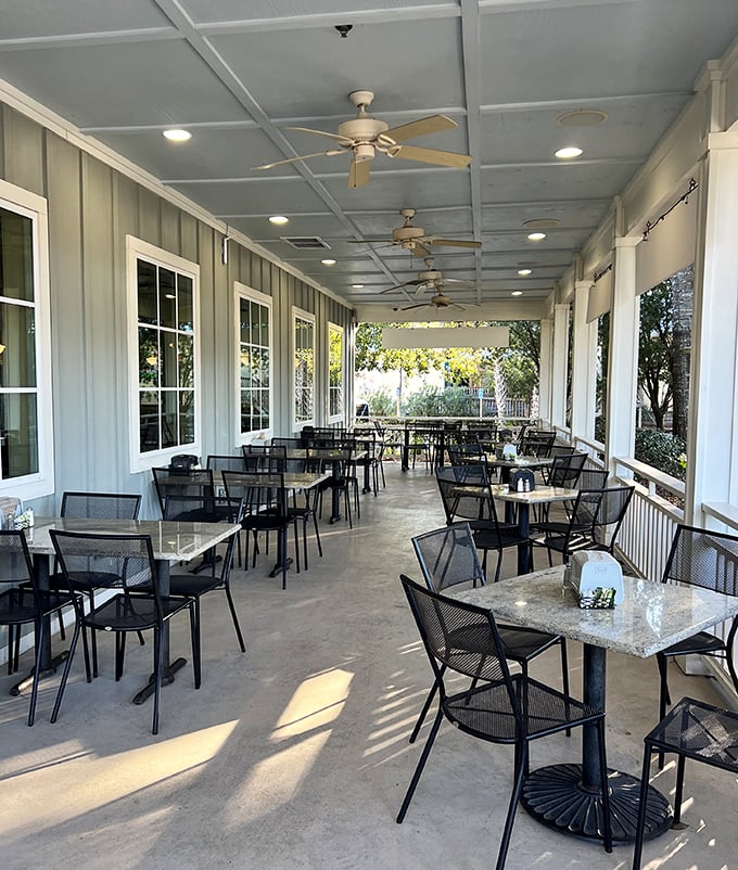The breezy porch seating offers a perfect respite between beach adventures. Southern charm meets coastal comfort.