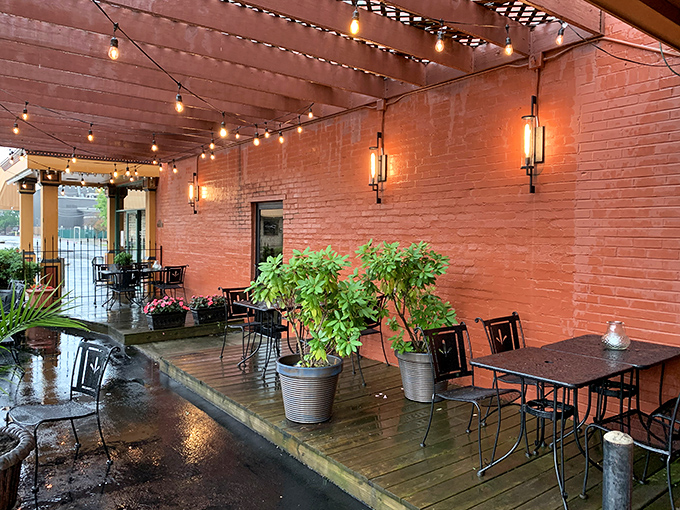 The charming patio where summer evenings stretch into night, string lights twinkling above as you contemplate a second helping of gnocchi.
