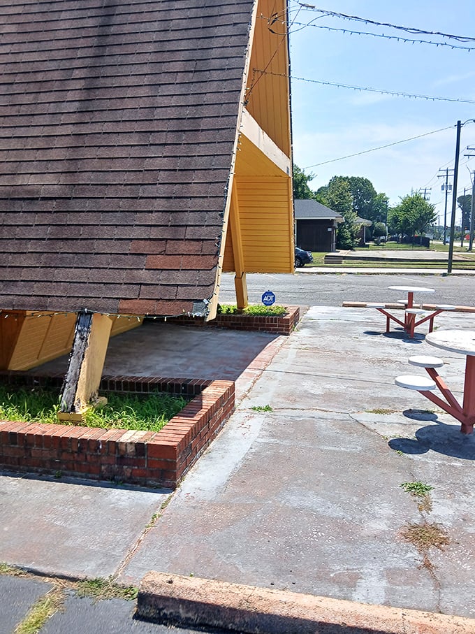 Even the outdoor space embraces the distinctive A-frame architecture, creating a landmark that cheese enthusiasts can spot from blocks away.