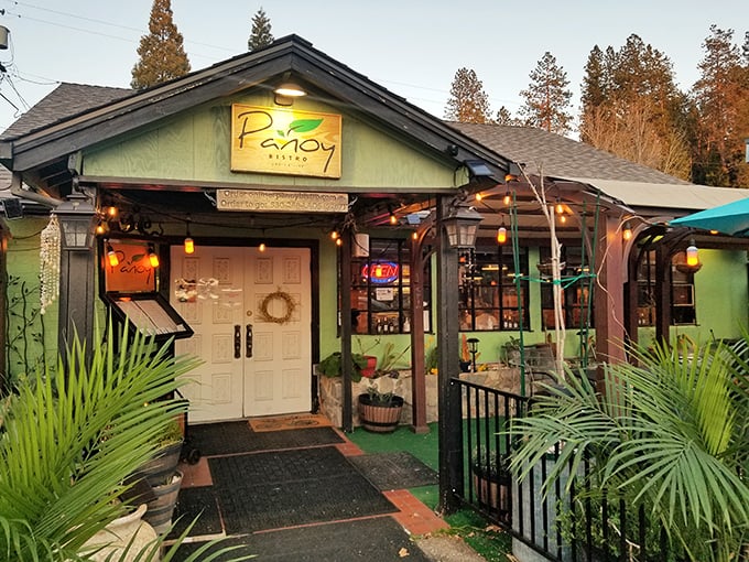 Panoy Bistro's cozy exterior promises culinary surprises inside, where string lights and tropical plants set the mood for evening dining.