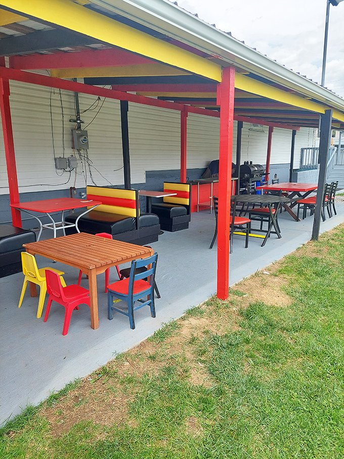 Colorful chairs under a rainbow of support beams &ndash; because great food deserves a backdrop that's equally cheerful.