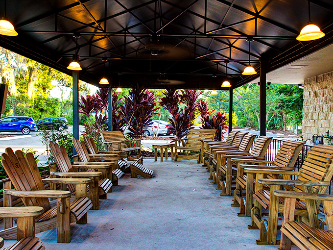 The outdoor waiting area—where Adirondack chairs and tropical plants create Florida's version of a breakfast pre-game show.
