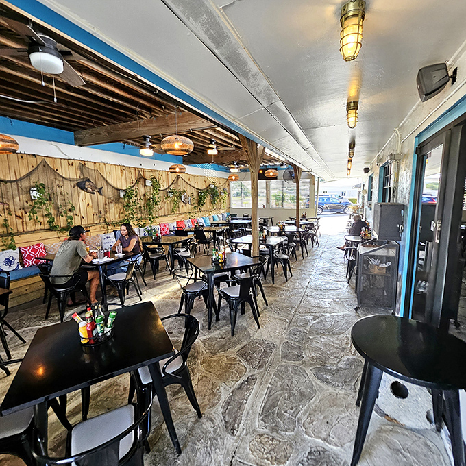 The patio offers that indoor-outdoor Florida living we all crave&mdash;casual seating, natural light, and the promise of a gentle breeze between courses.
