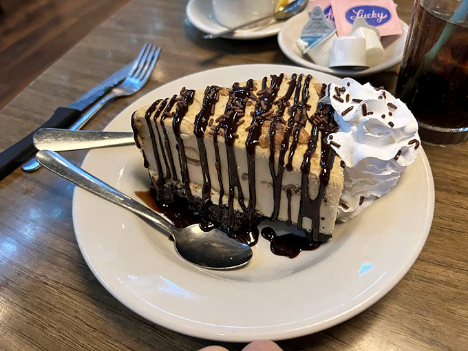 This slice of peanut butter pie with chocolate drizzle isn't just dessert&mdash;it's therapy on a plate, no appointment necessary.
