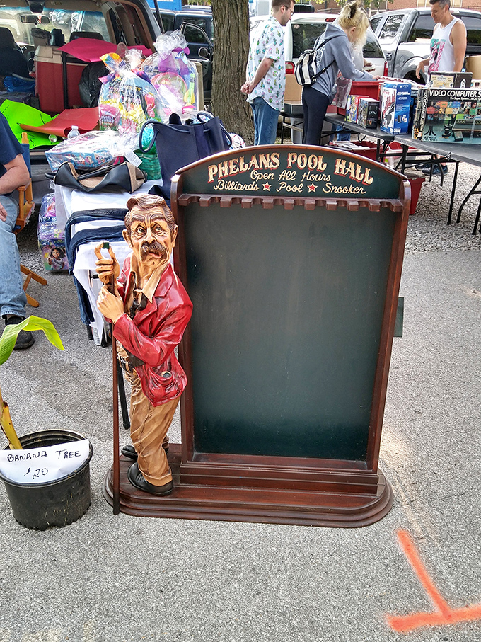 Not just a sign, but a conversation piece! This vintage-style Phelan's Pool Hall board comes with its own built-in barfly.