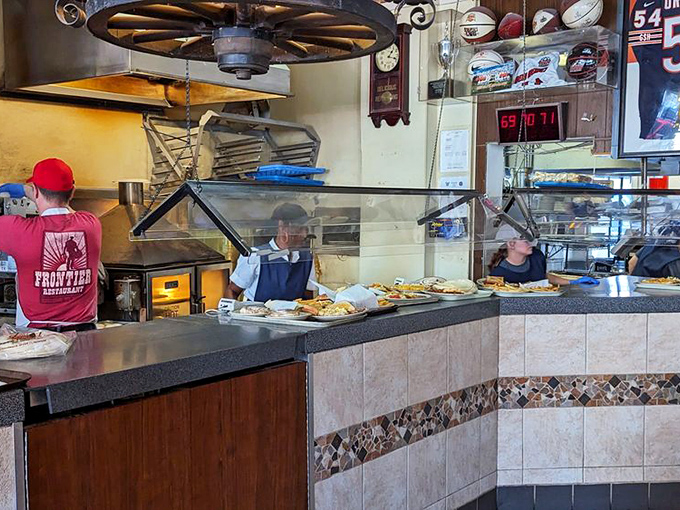 Behind this counter, culinary magic happens with the efficiency of a NASA launch and the warmth of your grandmother's kitchen.