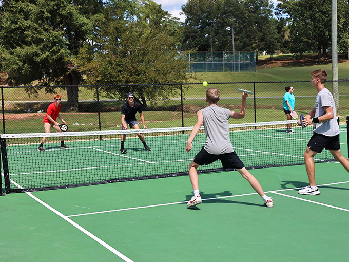 Pickleball: where retirement energy finds its perfect outlet and competitive spirits prove age is just a number your joints occasionally remind you about.