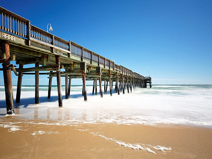 The Little Island Fishing Pier stretches toward the horizon like a wooden welcome mat to the Atlantic's bounty.