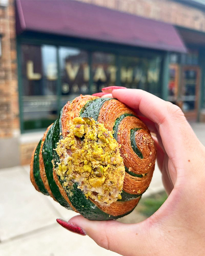 The pistachio croissant—where nutty green filling meets golden laminated dough in a French-inspired romance for the ages.