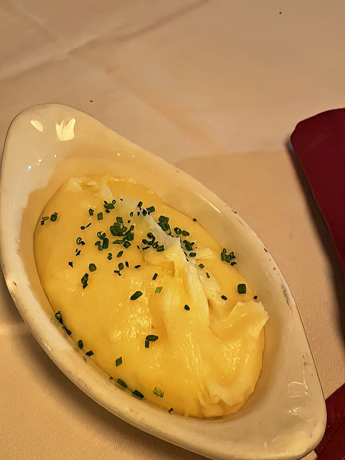 Pommes pur&eacute;e so silky and buttery it makes mashed potatoes seem like a completely different food group. Those chives aren't just garnish&mdash;they're necessary.