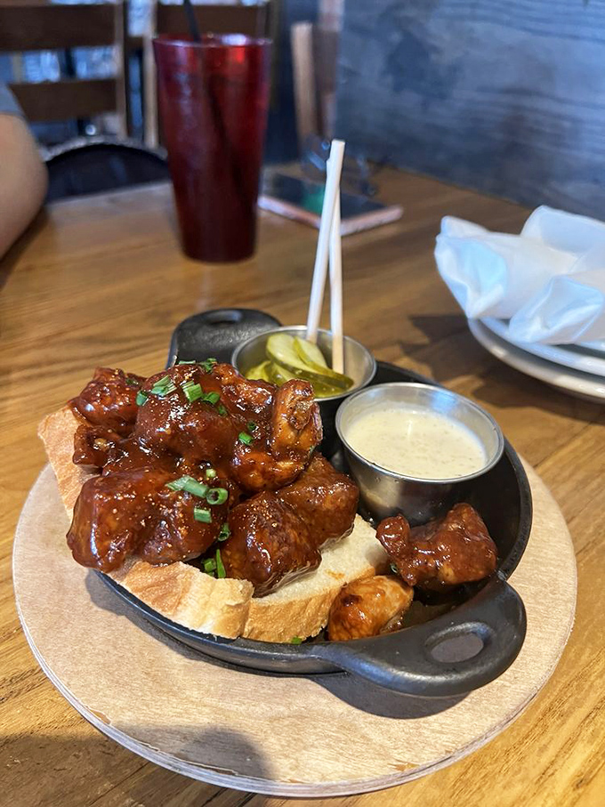 Burnt ends nestled on toast points like meaty jewels. The accompanying pickles and sauce aren't condiments&mdash;they're supporting actors in a delicious drama.