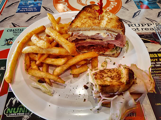 A proper diner sandwich should require both hands and several napkins. This Reuben with golden fries is making a strong case for the perfect lunch.