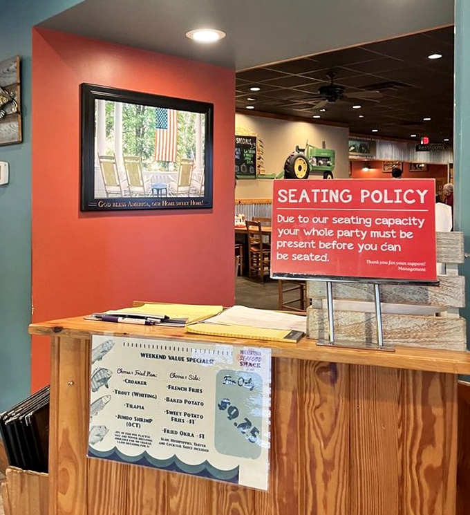 Even the seating policy sign has personality&mdash;a gentle reminder that good things come to those who wait with their entire party.