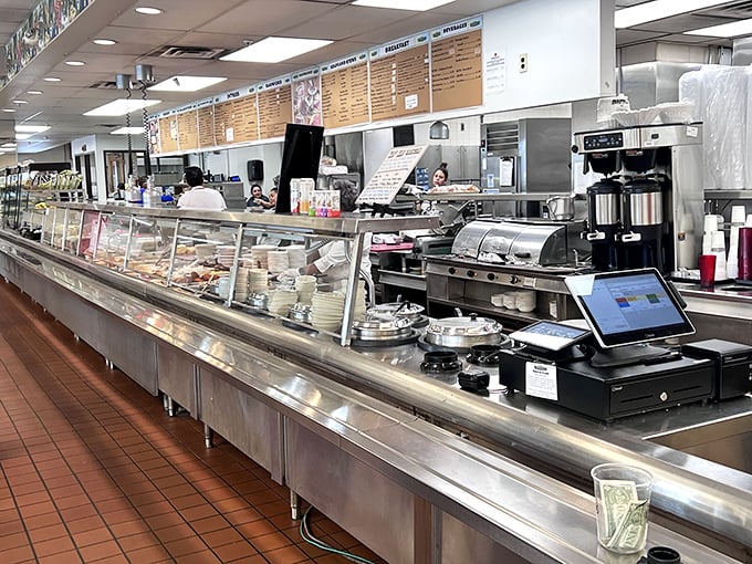 The service counter where sandwich dreams become reality. Notice the tip jar&mdash;karma and good sandwiches both require proper funding.