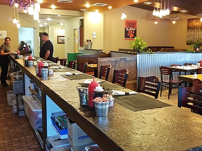 The counter where magic happens. Note the tiny metal condiment baskets&mdash;the unsung heroes of diner dining experiences everywhere.