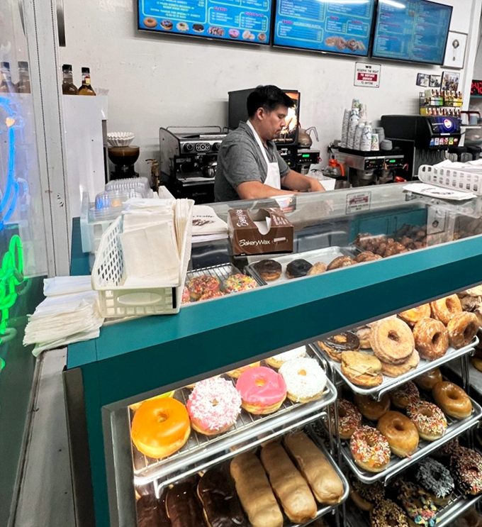 Behind every great donut shop is someone who understands the sacred responsibility of feeding people's happiness. The real magic happens behind that counter.