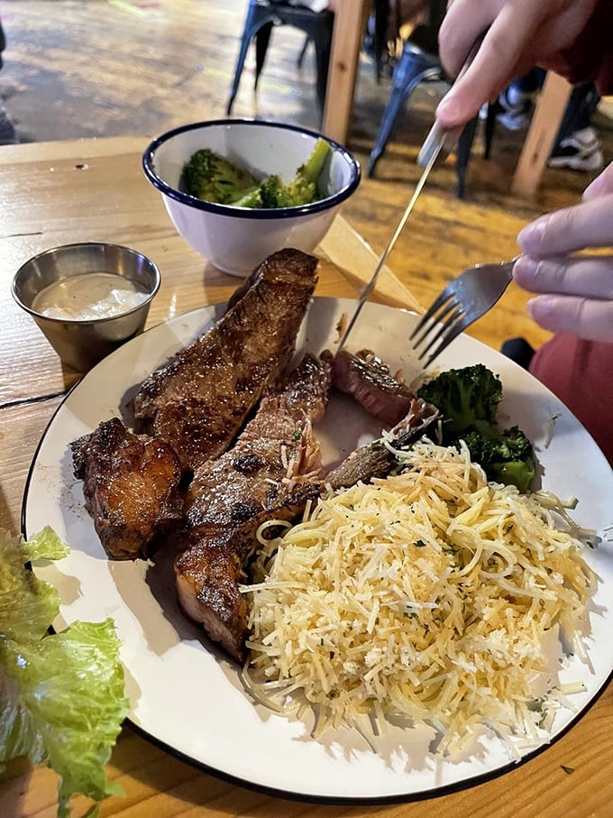 Steak strips that mean business, served alongside pasta that's been thoroughly cheesified &ndash; a plate that says "you won't need dinner tonight."