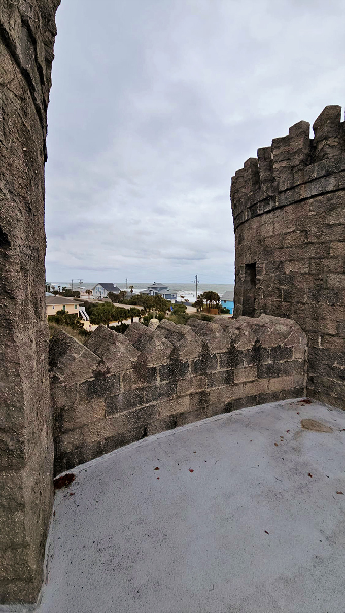 Between the castle's protective walls, visitors glimpse the Florida coastline&mdash;a surreal juxtaposition of medieval fortress and beach community.