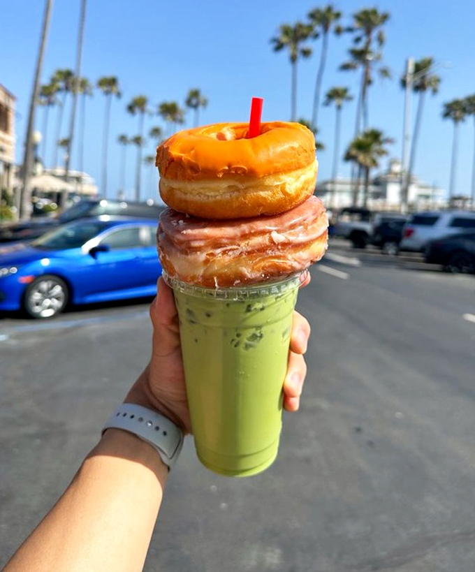 Stacked donuts transform an ordinary plastic cup into California's most inventive trophy&mdash;first prize for finding morning joy.