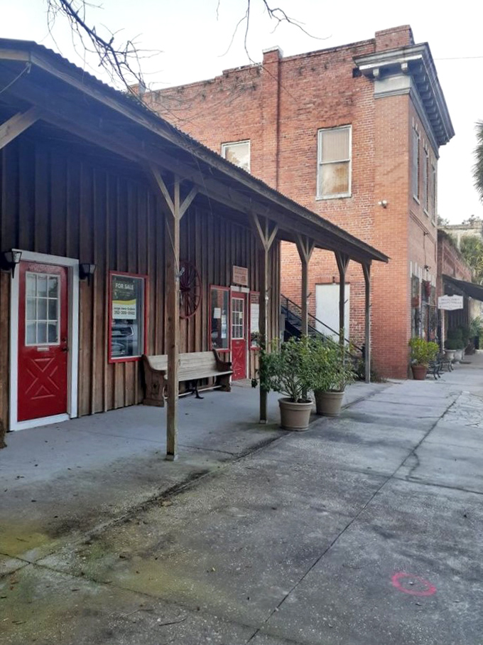 These wooden storefronts with their red doors seem to whisper, "Slow down, partner – we've been here since before air conditioning, and we're not rushing now."