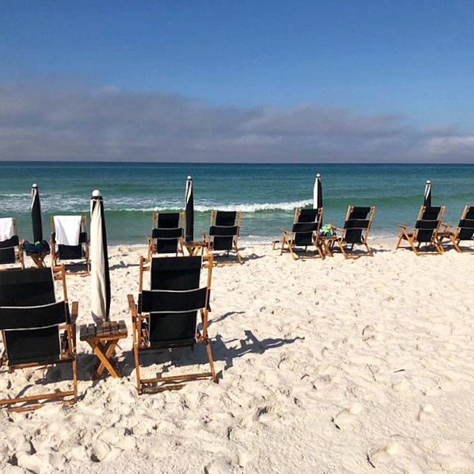 Beach chairs awaiting their next occupants&mdash;like a lineup of front-row seats to nature's best show: the Gulf of Mexico.