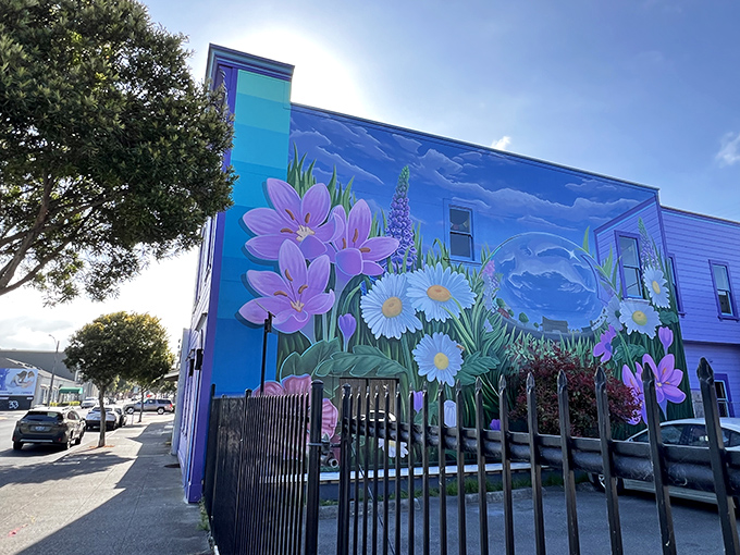 A building-sized bouquet blooms on this vibrant mural, proving that in Eureka, even the sides of buildings become canvases for botanical dreams.