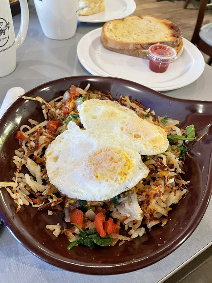 A skillet that tells a colorful story&mdash;crispy potatoes, vibrant vegetables, and those sunny-side-up eggs acting like the morning stars of this breakfast galaxy.
