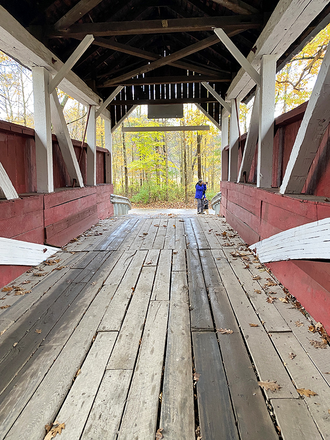 Visitors frame their memories against weathered wood and white trusses, collecting moments that won't fit on Instagram.