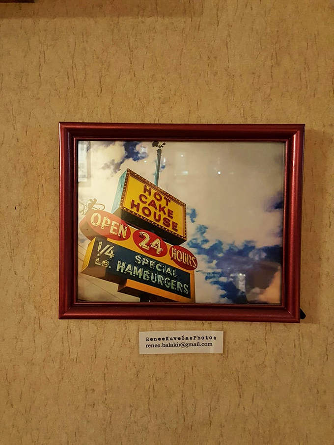 The framed vintage sign photo serves as both art and historical document&mdash;proof that some things in Portland should never change.
