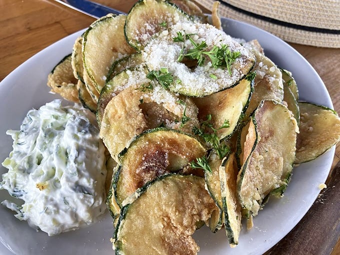 Zucchini chips dusted with kefalotiri cheese that will ruin potato chips for you forever. The tzatziki dip is not optional &ndash; it's essential.