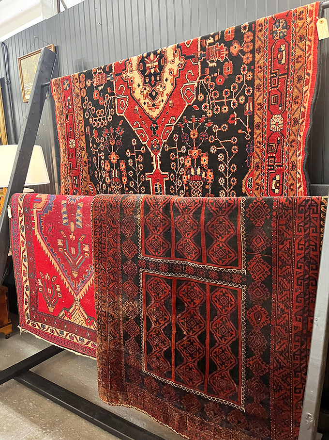 Handwoven Persian rugs display centuries-old craftsmanship in vibrant reds and blacks. Each geometric pattern tells stories that predate Netflix binges.