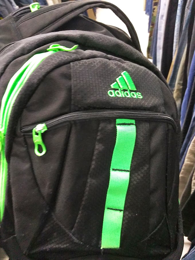 An Adidas backpack with electric green accents ready for its second act&mdash;school, gym, or weekend adventures await its new owner.