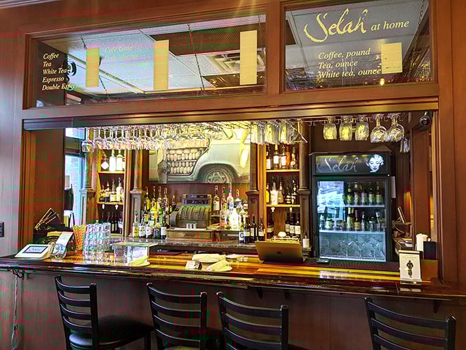 The bar at Selah proves that liquid assets come in many forms&mdash;wine glasses hanging like financial instruments ready for trading.