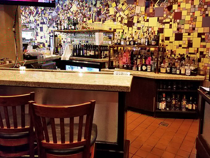 The bar area showcases an impressive selection, perfect for pairing with those famous crab cakes everyone raves about.