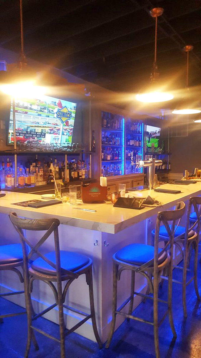 The bar glows with possibility, where craft cocktails are born and sports fans never miss a play&mdash;the perfect prelude to steak paradise.