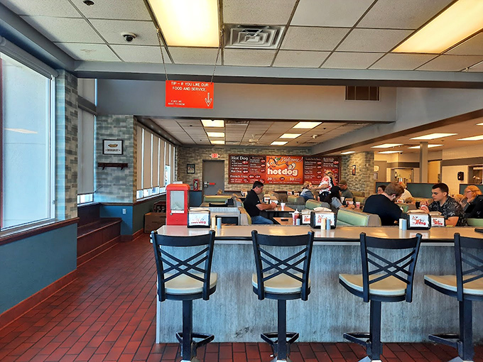Counter seating where regulars have claimed their spots since before cell phones, perfect for solo diners seeking community.