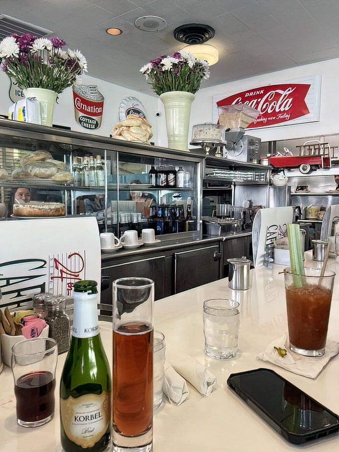 The counter area showcases both drinks and desserts, a dangerous proximity that has led to many "well, I'm already here" decisions.