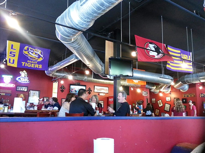 The lively bar area, where LSU and FSU flags wave in peaceful coexistence, united by the universal language of good food and cold drinks.