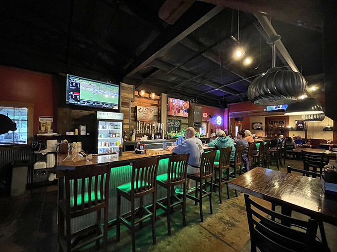The bar area—where strangers become friends over drinks and shared appreciation for whatever's emanating from those kitchen smokers.