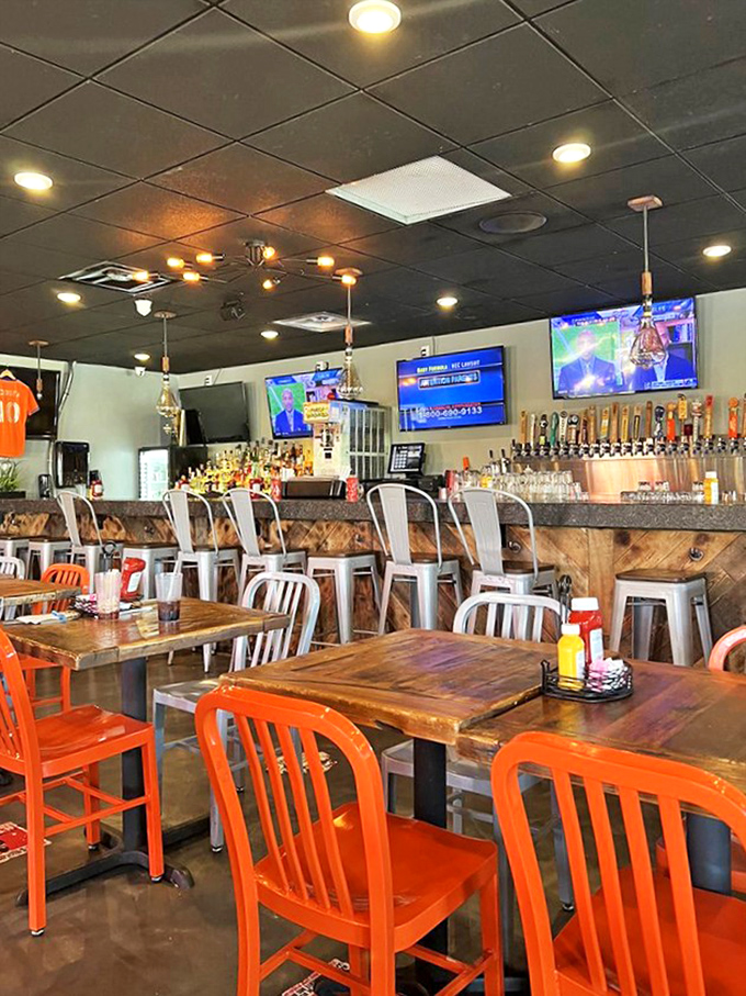 The bar counter combines rustic wood with modern design, creating the perfect perch for solo diners or those who appreciate a front-row culinary view.