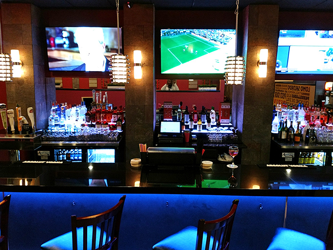 The bar area glows with promise, offering Peruvian libations to complement your meal. Those pendant lights create the perfect mood for culinary exploration.