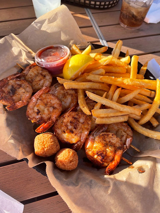 Blackened shrimp skewers with golden hush puppies&mdash;a taste of the Gulf that makes you wonder why you don't live at the beach year-round.