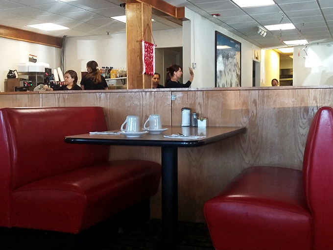 These cherry-red booths have cradled more morning conversations and "aha" moments than most therapists' couches in the state.