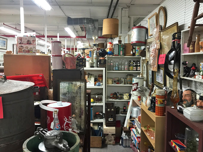 A booth that feels like raiding your coolest relative's basement &ndash; vintage Coca-Cola memorabilia mingles with collectibles spanning decades.