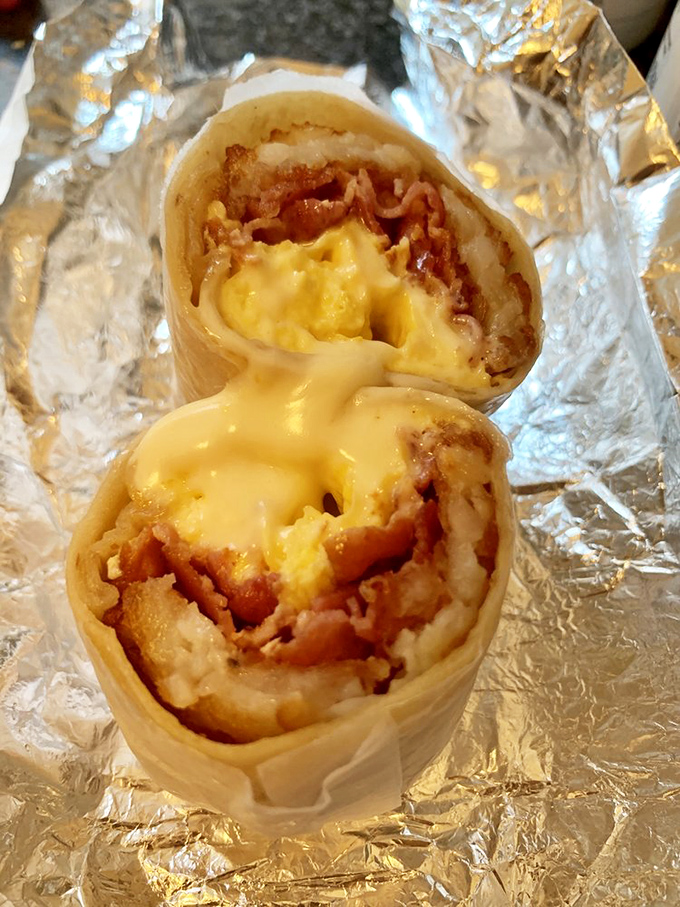 Breakfast's most portable innovation: the burrito that combines eggs, bacon, and cheese in a handheld miracle of morning sustenance.