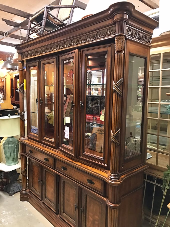 This isn't just a cabinet; it's architectural royalty with columns that would make ancient Romans slow-clap in appreciation.