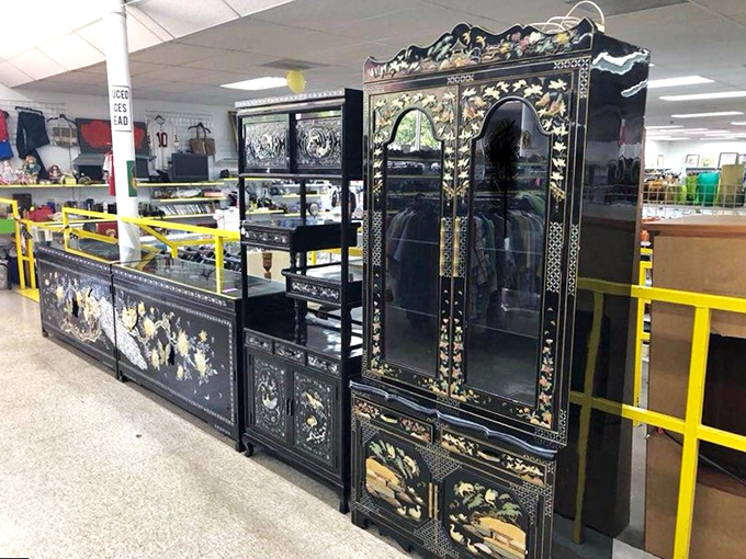 Ornate furniture pieces stand like displaced royalty, waiting for new kingdoms at prices that won't bankrupt you.