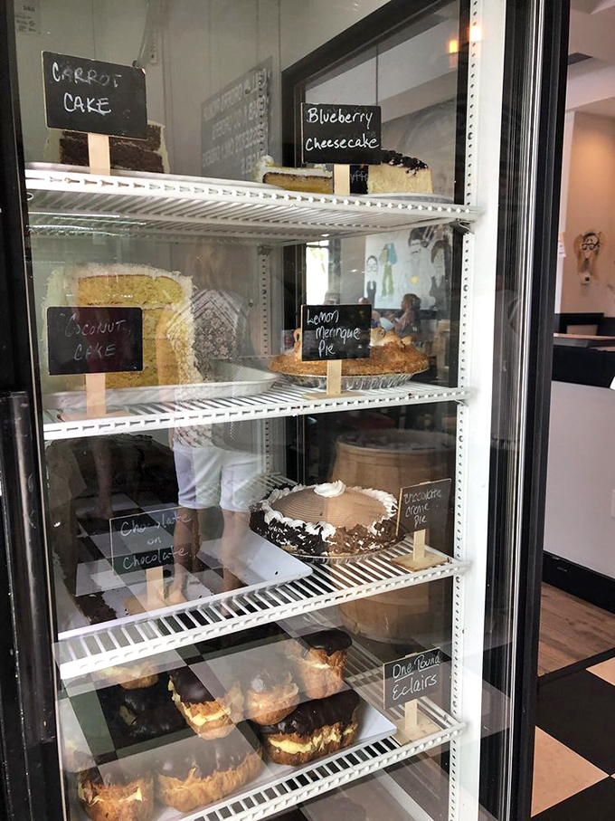 A cake display that makes you realize why people invented celebrations—just to have an excuse to bring one of these beauties home.